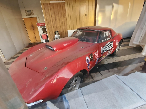 Drag vette inside abandoned machine shop Trans Am street racer next to ...